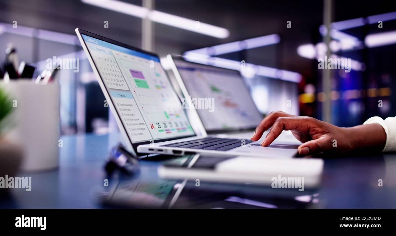 Managing Tasks and Schedules with Gantt Calendar on Laptop Screen ...
