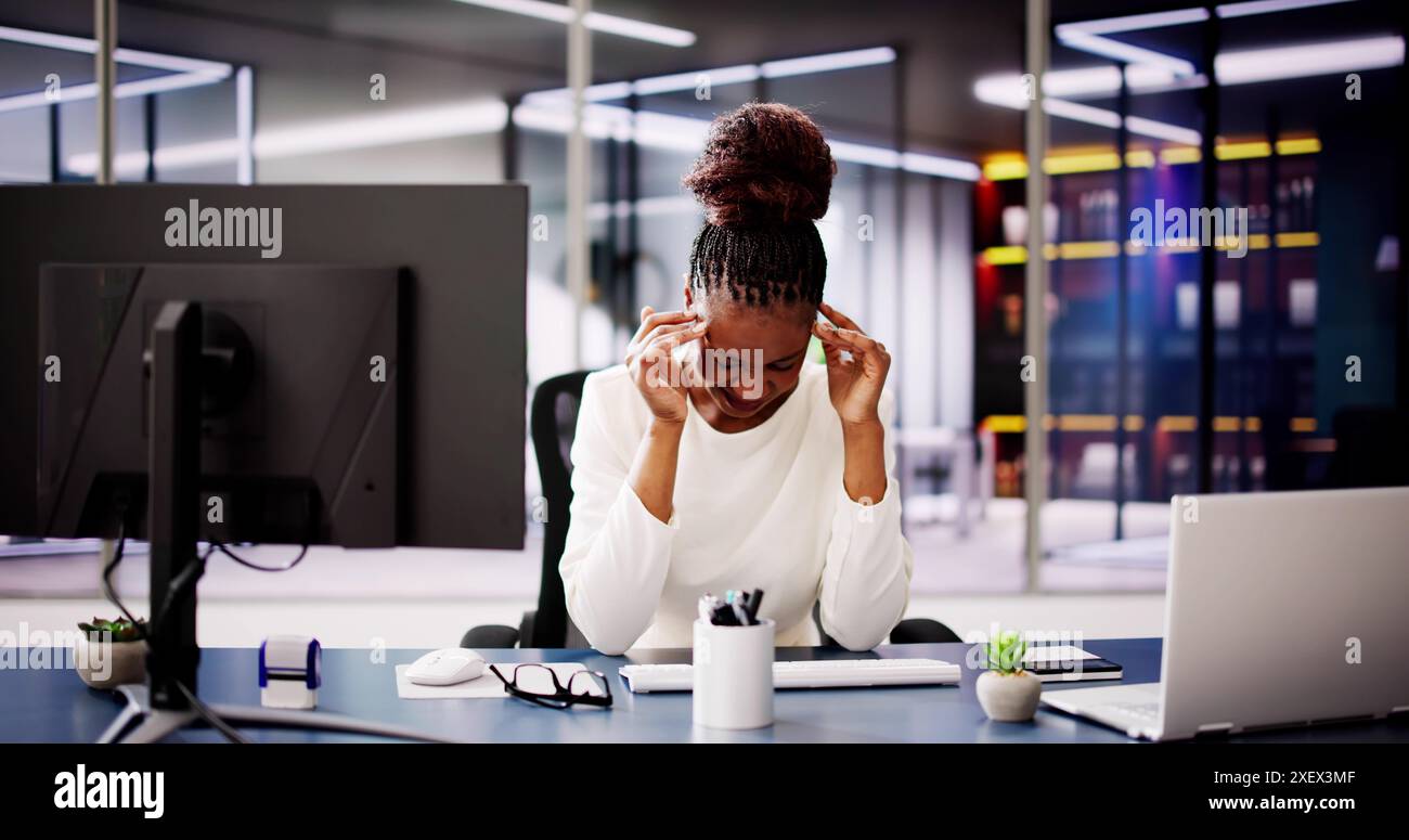 Exhausted Businesswoman Working on Computer in Office, Fighting Stress ...