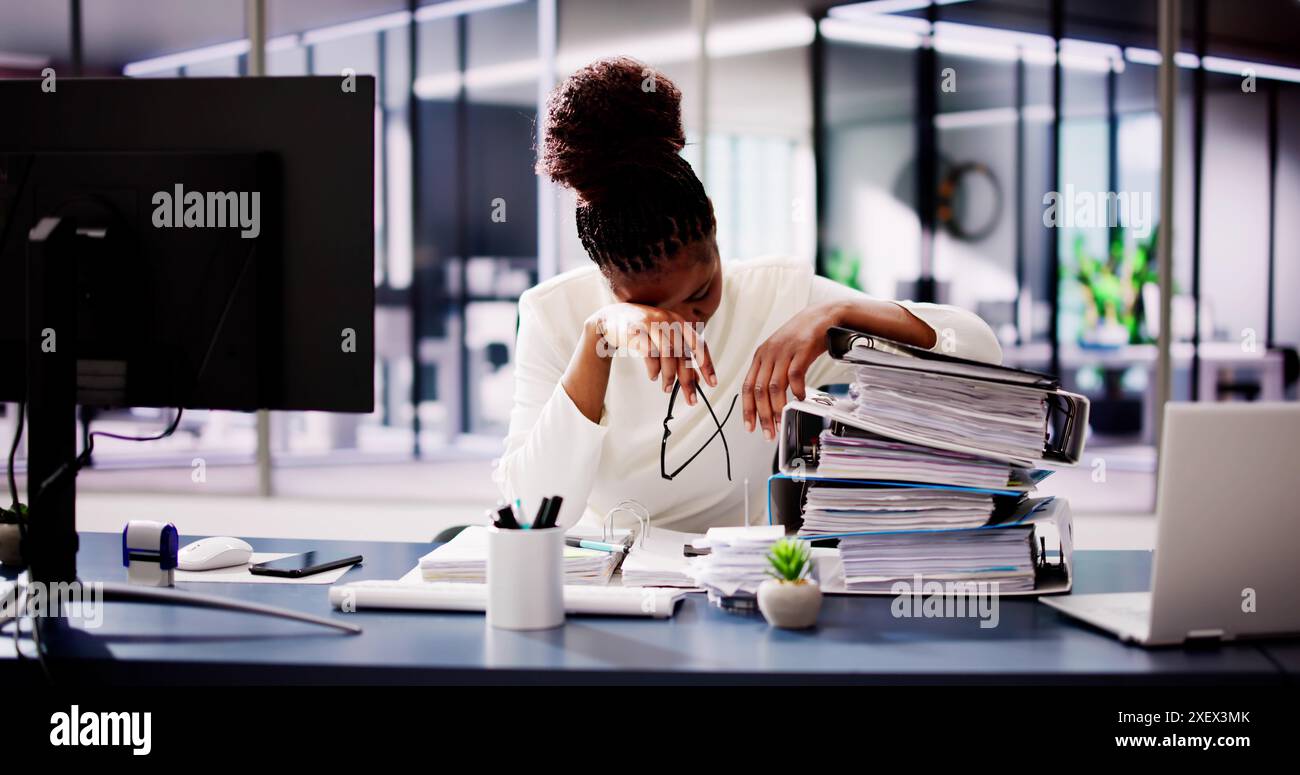 Overworked Businesswoman Struggles with Tax Calculations at Desk in ...