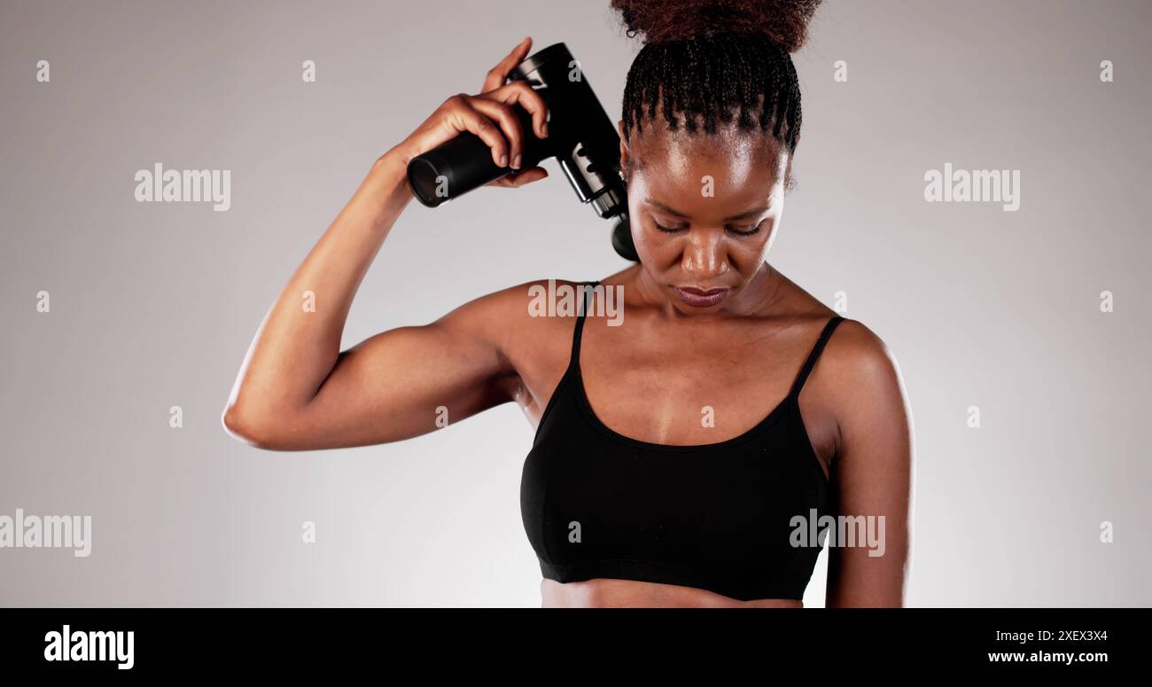 Personal trainer using massage gun hi-res stock photography and images ...