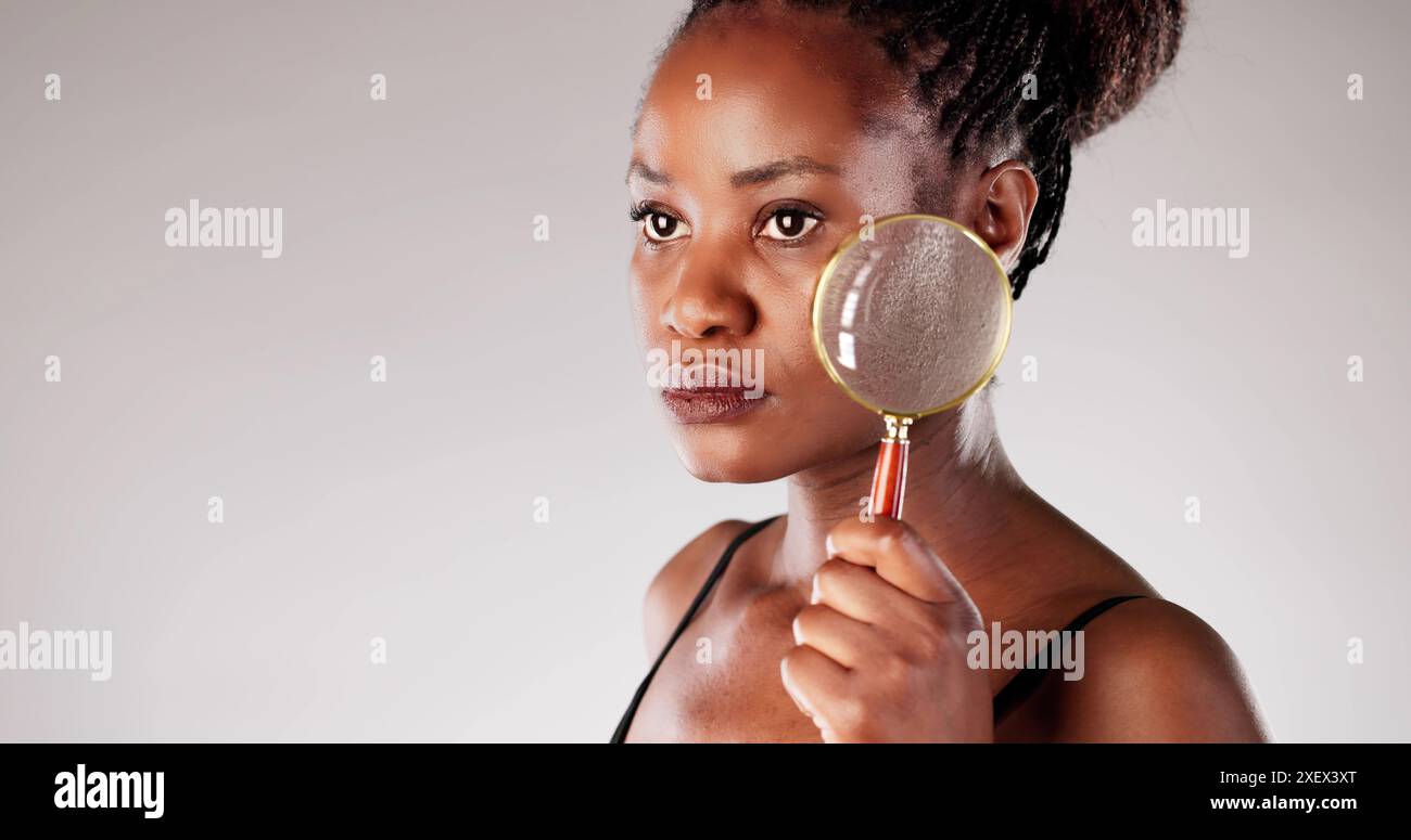 Dermatologist using magnifying glass to investigate rosacea skin ...