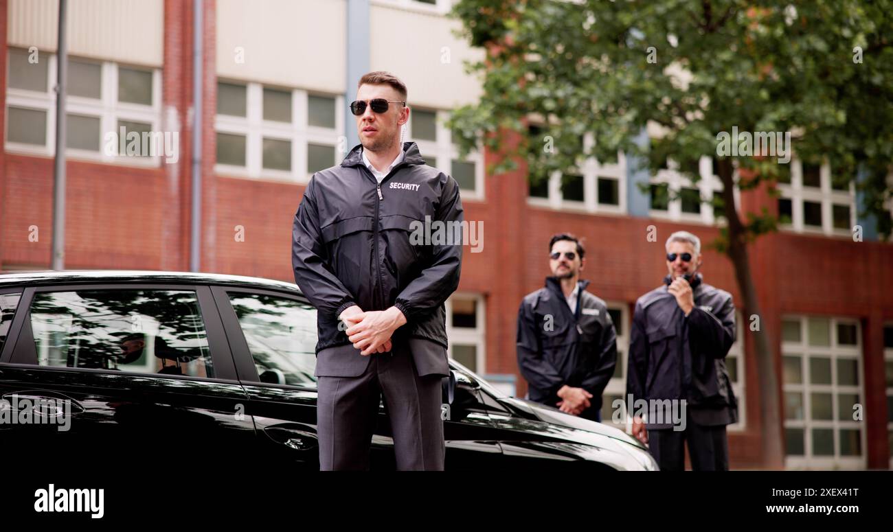Handsome Caucasian Male Security Agent Safeguarding Luxury Vehicles for ...