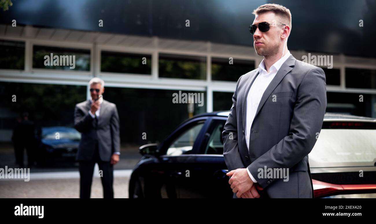 Corporate Executive Protected by Professional Security Guard Near High ...