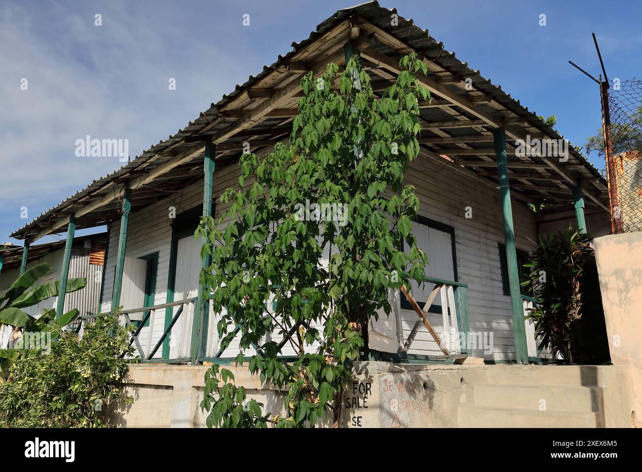455 Vernacular wooden house of timber planks with porch on concrete ...