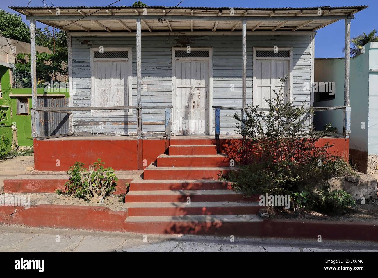 456 Vernacular wooden house of timber planks with porch on concrete ...
