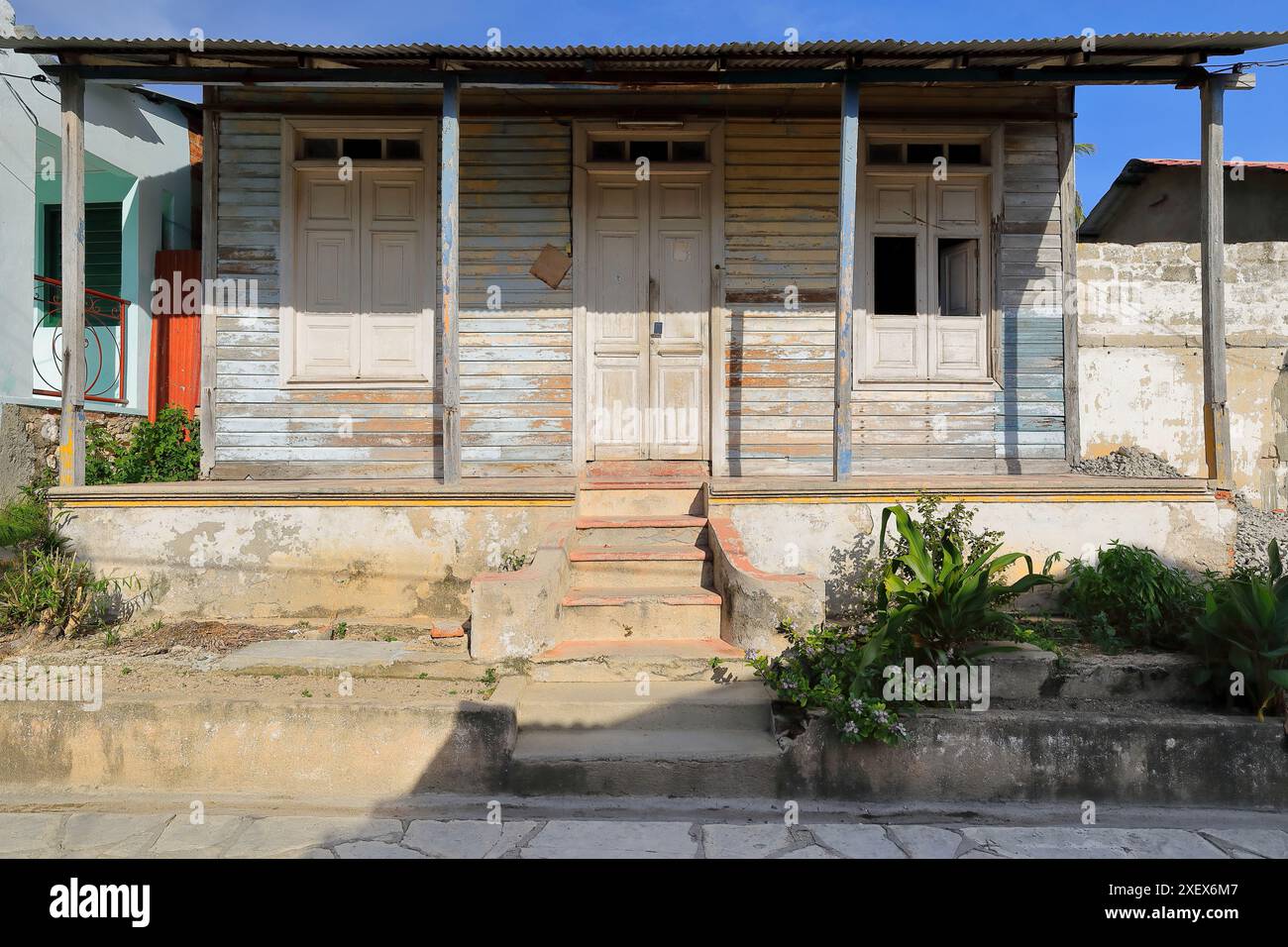 457 Vernacular wooden house of timber planks with porch on concrete ...