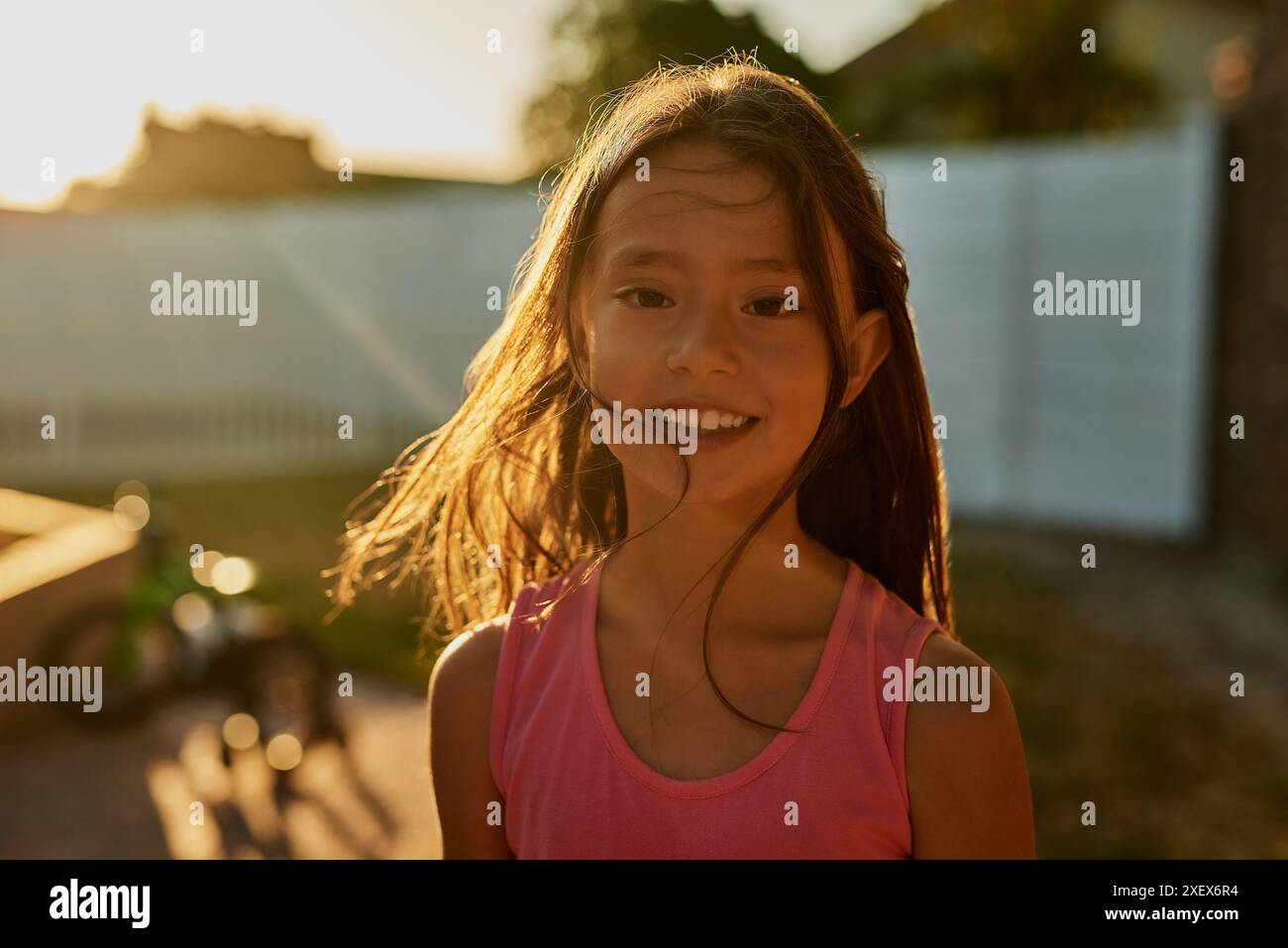 Children, portrait and girl in backyard for sunset games, learning or having fun on vacation ...