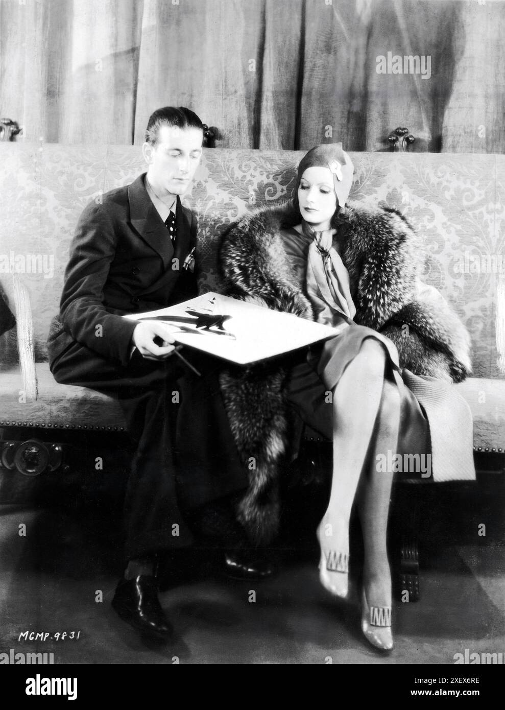 Costume Designer GILBERT ADRIAN and GRETA GARBO late 1928 on set candid ...