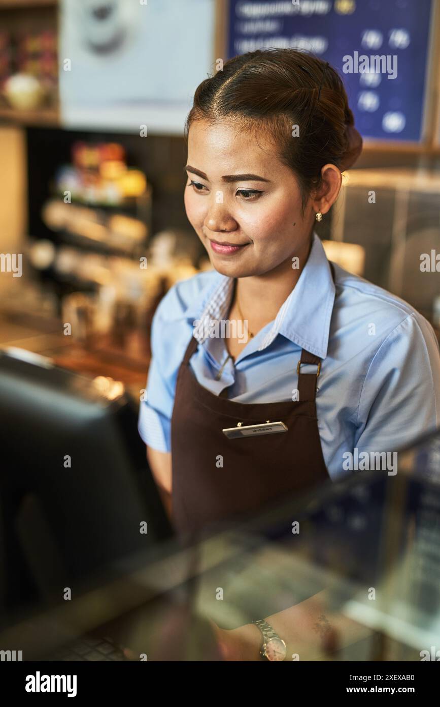 Asian woman female cashier hi-res stock photography and images - Alamy