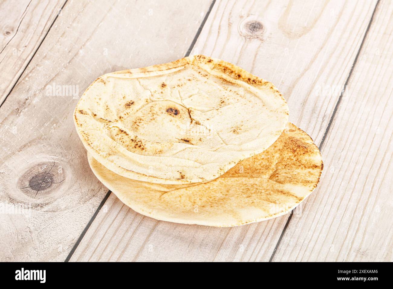 Traditional eastern round pita bread for breakfast Stock Photo - Alamy