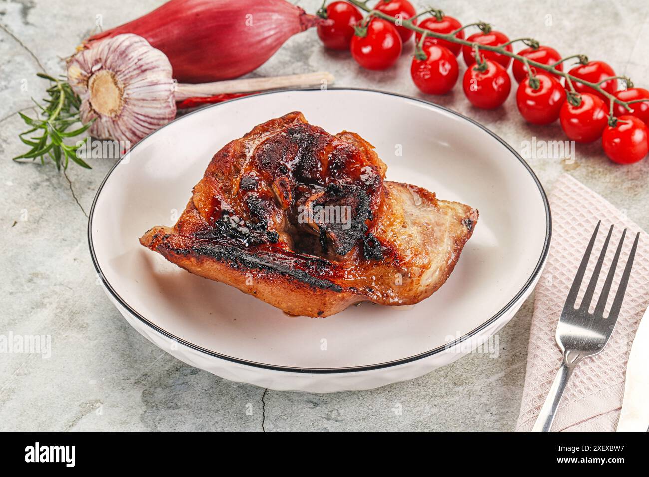 Roasted pork knuckle steak with bone Stock Photo - Alamy