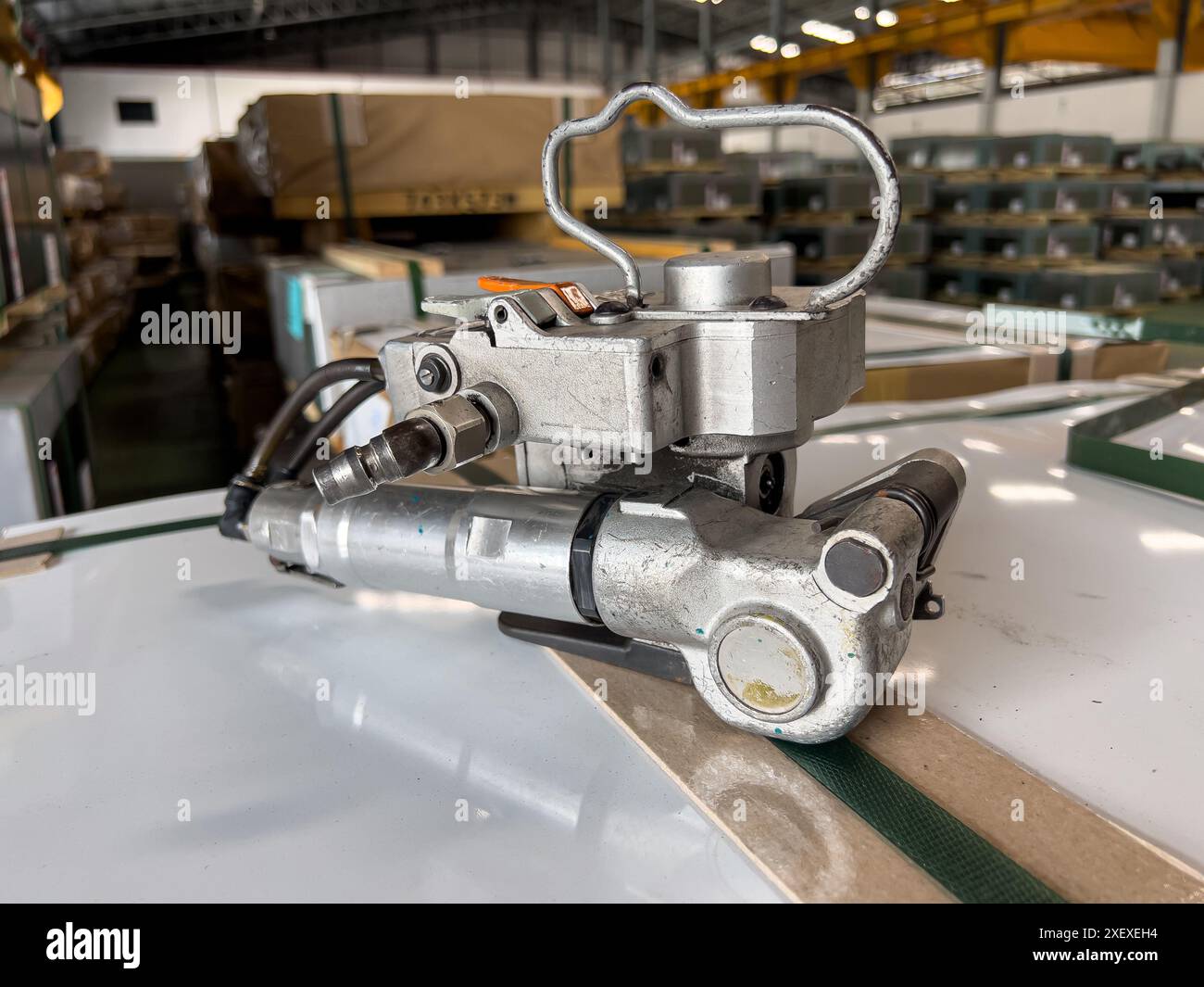 Strapping Machine | Pneumatic PET Strapping Tool for Packaging. (Soft focus Stock Photo - Alamy