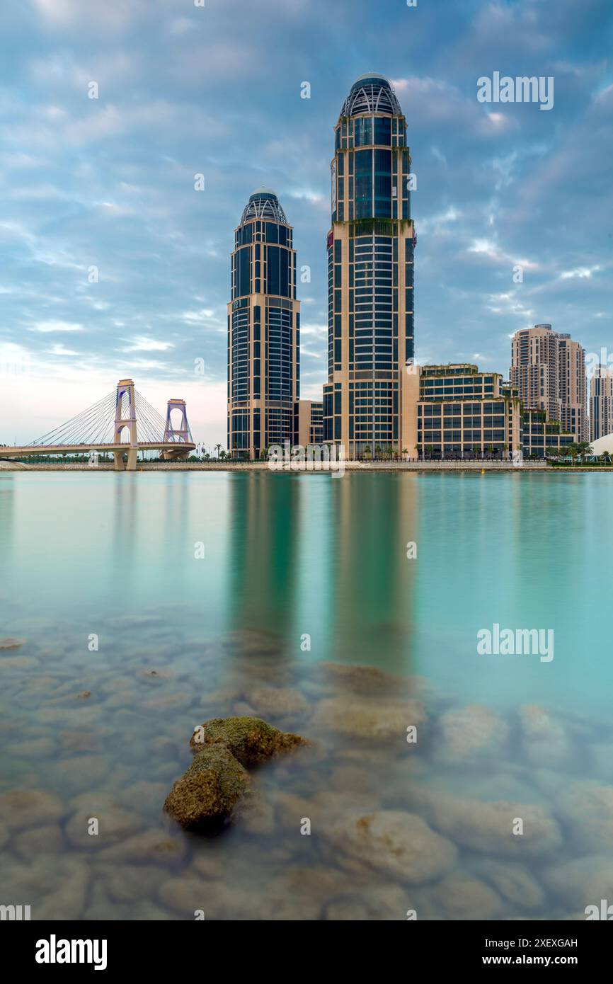 UDC twin tower Pearl Qatar view with gewan bridge Stock Photo - Alamy