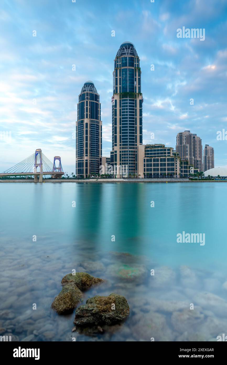 UDC twin tower Pearl Qatar view with gewan bridge Stock Photo - Alamy
