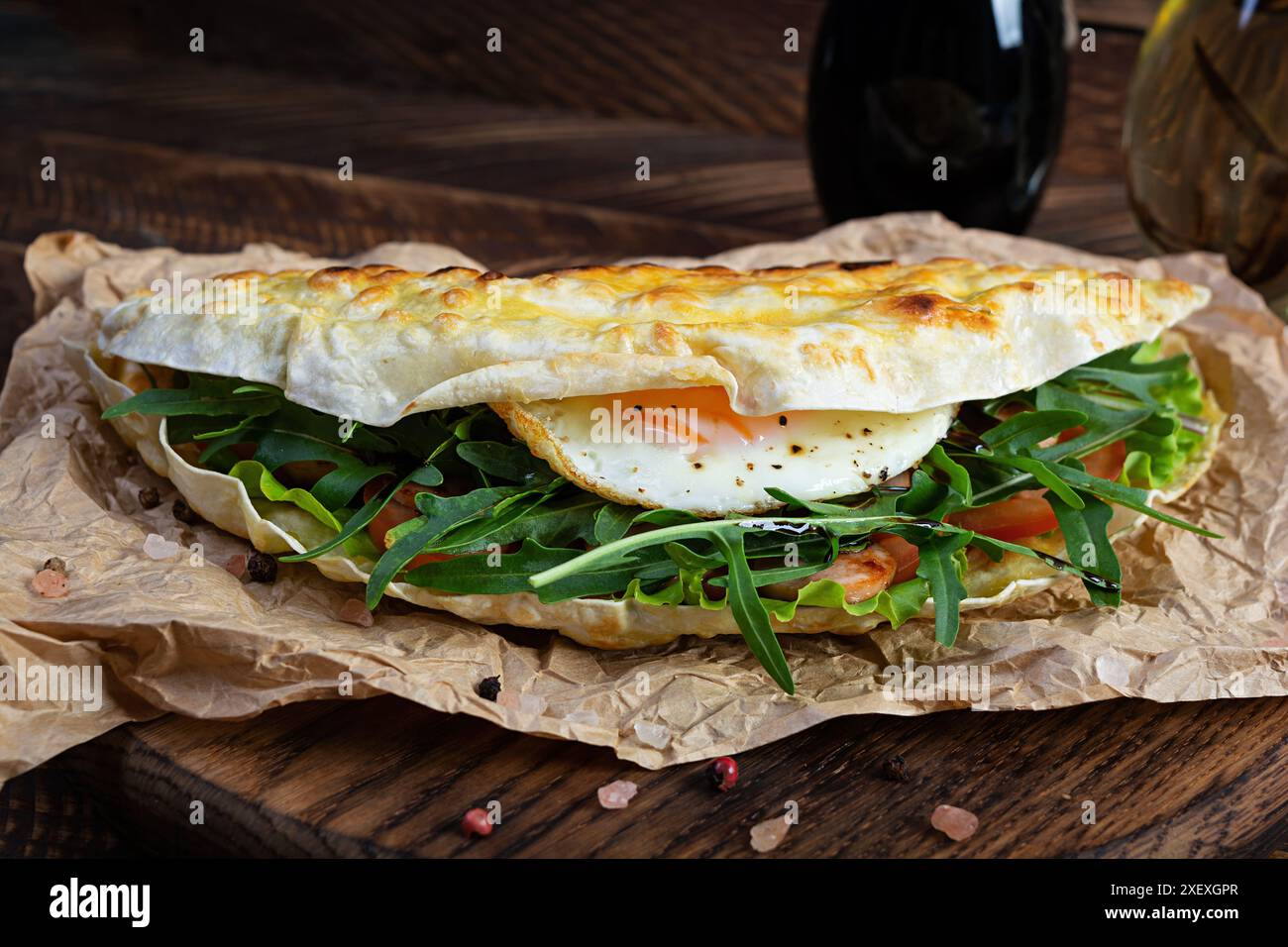 Grilled stuffed lavash with herbs, tomato and egg. Lavash sandwich ...
