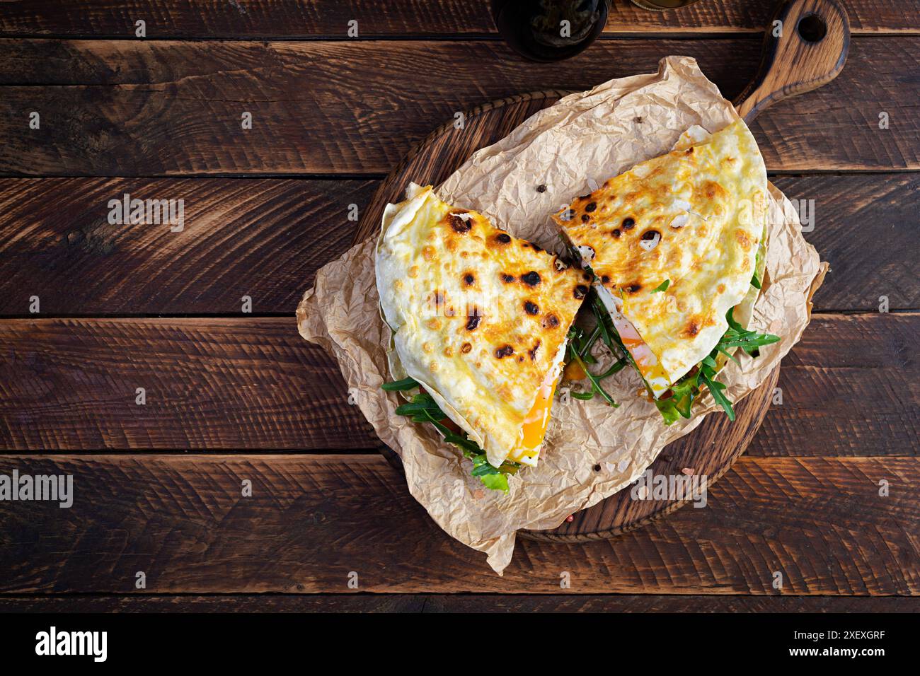 Grilled stuffed lavash with herbs, tomato and egg. Lavash sandwich ...