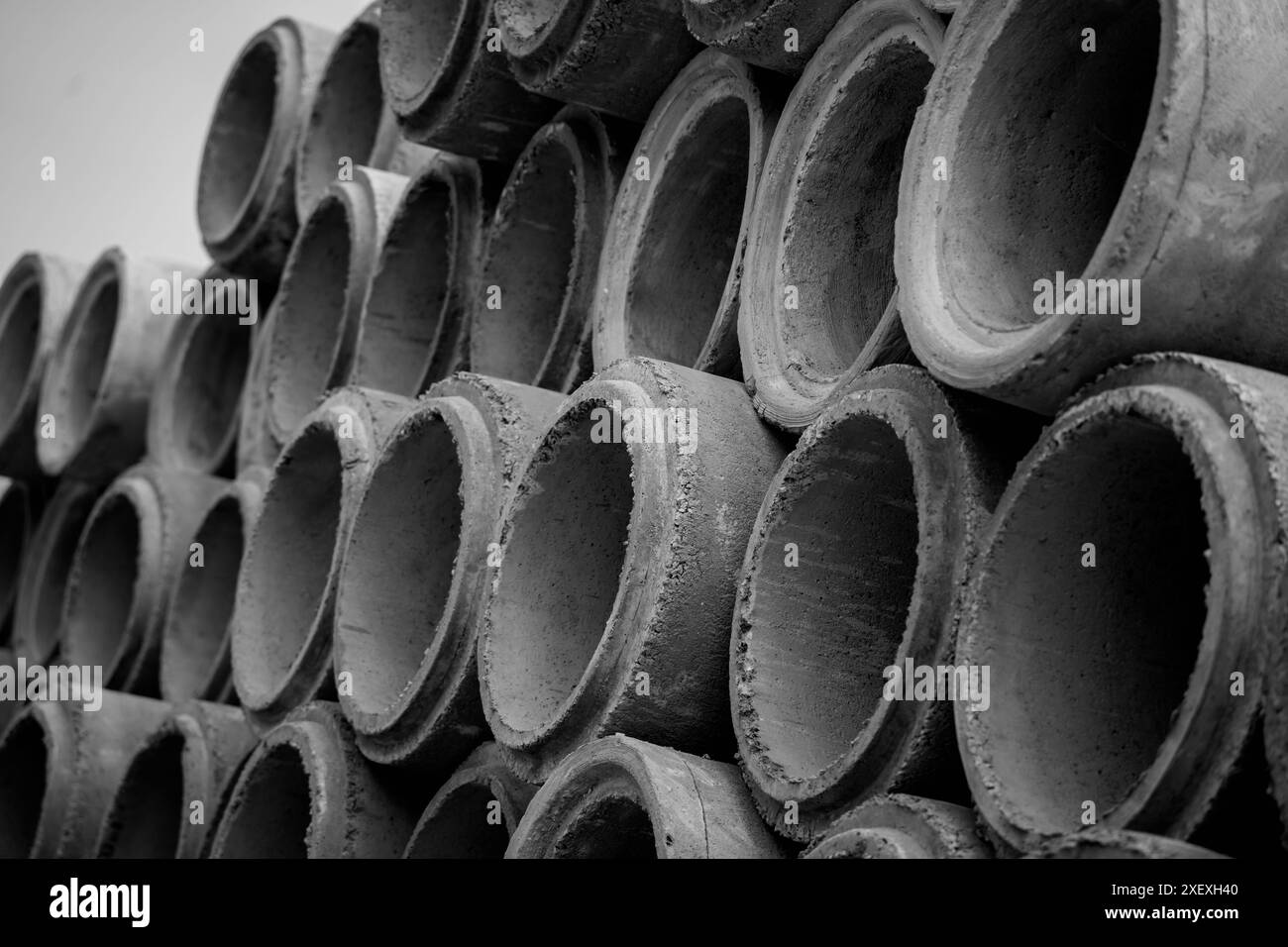 A stack of concrete ring pipes piled and creating a symmetrical ...