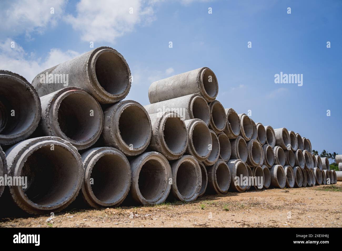 A stack of concrete ring pipes piled and creating a symmetrical ...