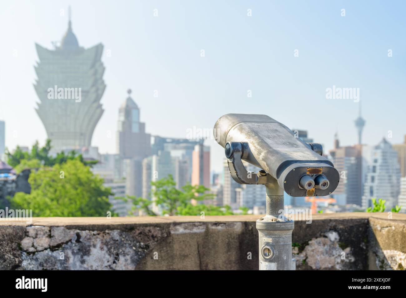 Tower viewer at observation deck in Macau. Coin-operated binoculars ...