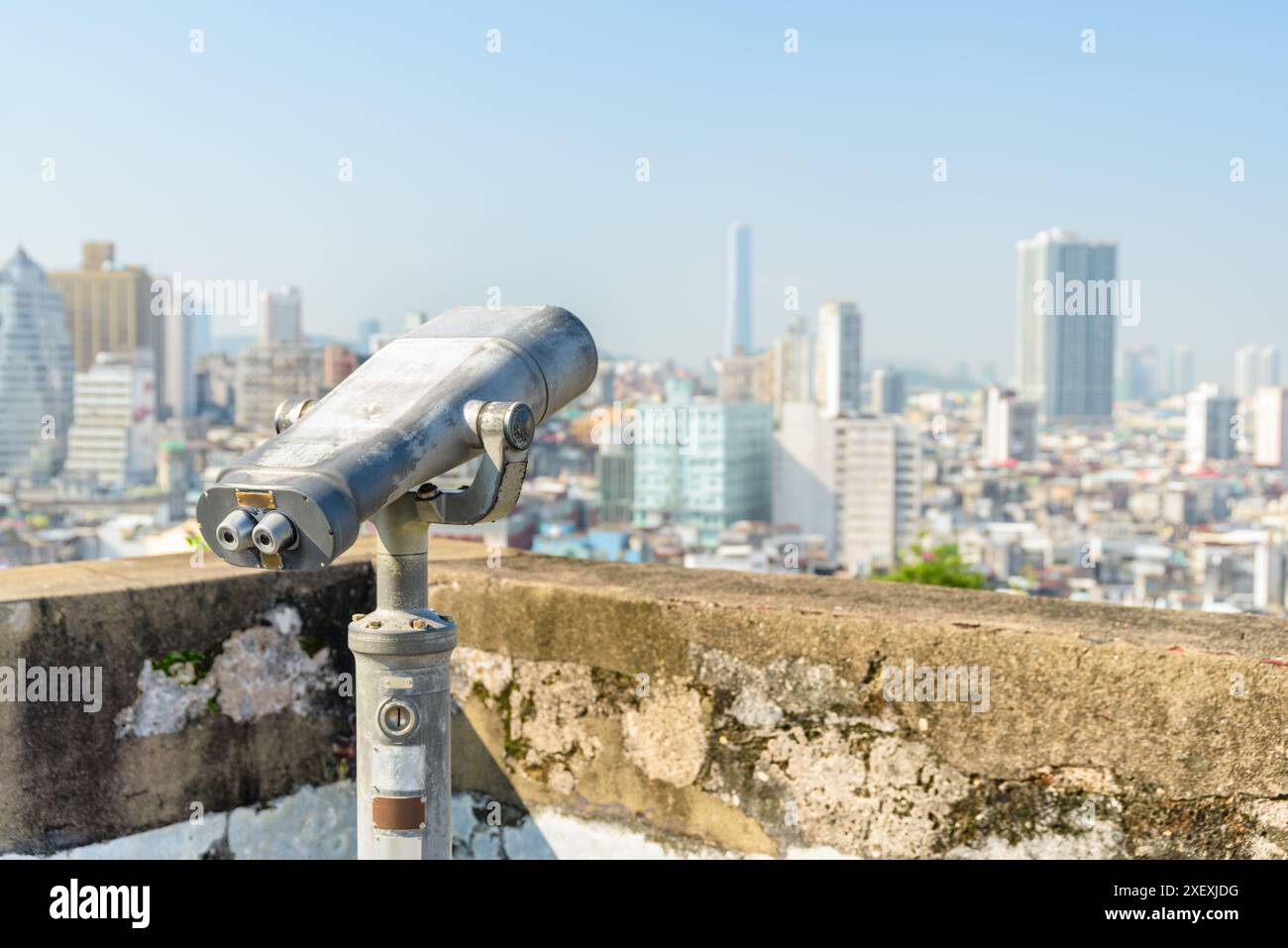 Tower viewer at observation deck in Macau. Coin-operated binoculars ...