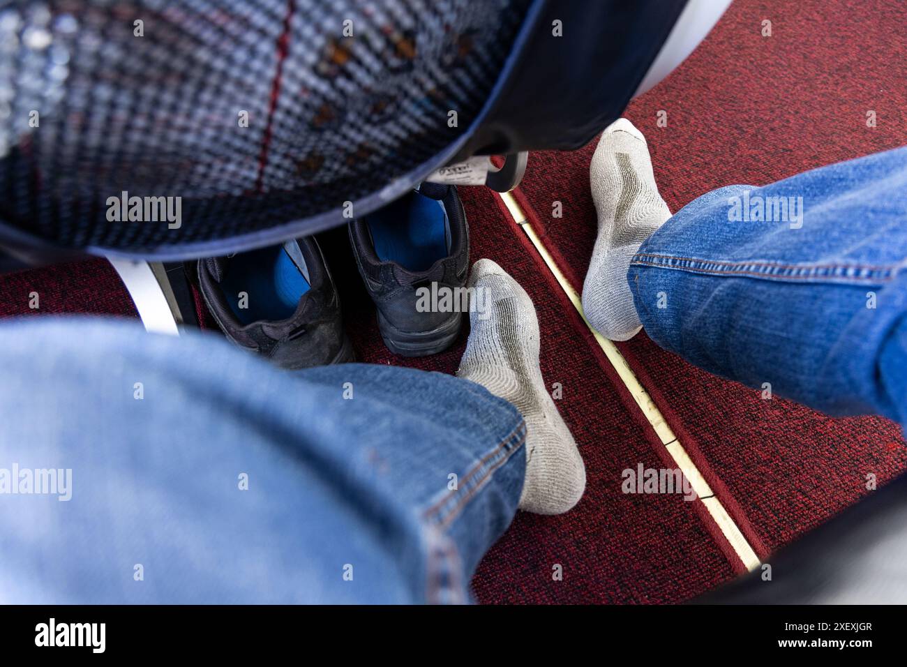 AIrplane passenger removed shoes in cabin to relax feet during long ...