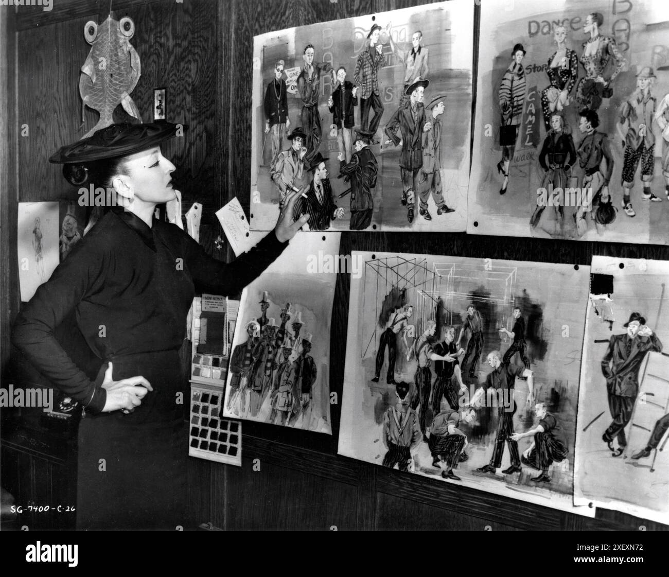 Costume designer IRENE SHARAFF poses with some of her sketches for the ...