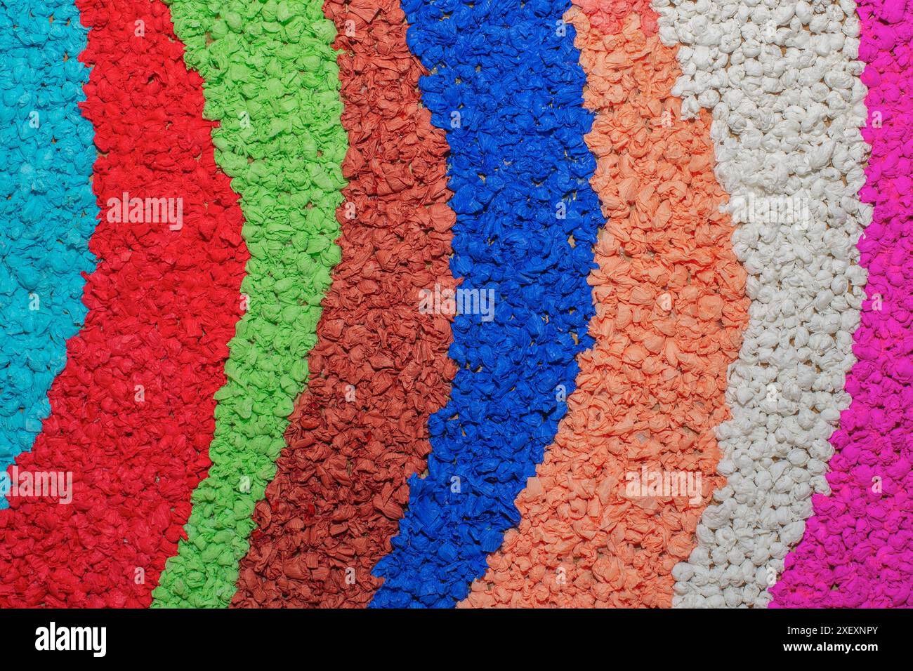 Creative striped mosaic made of colorful tissue paper rolled into small ...