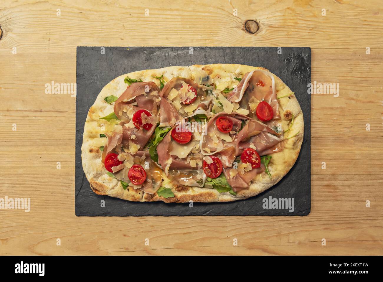 tomato sauce, mozzarella cheese, and additional toppings such as ...