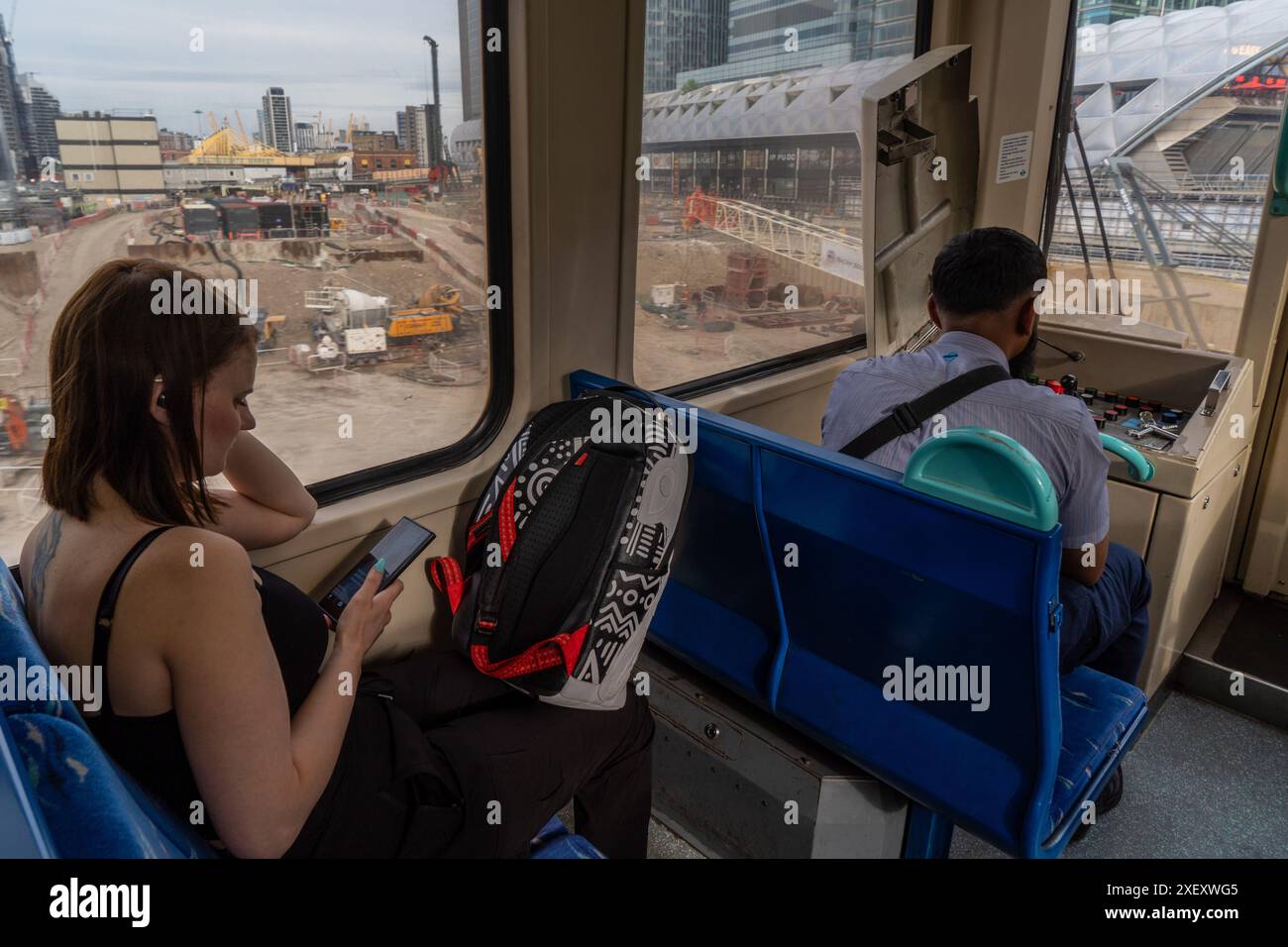 Docklands Light Railway (DLR ) station, with Canary Wharf buildings in ...