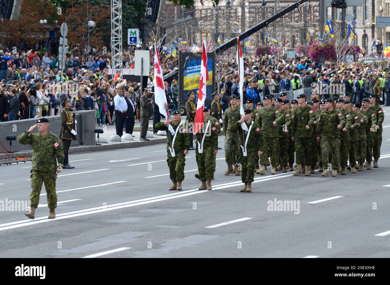 Canadian military men, officers flying national flag, marching on a ...