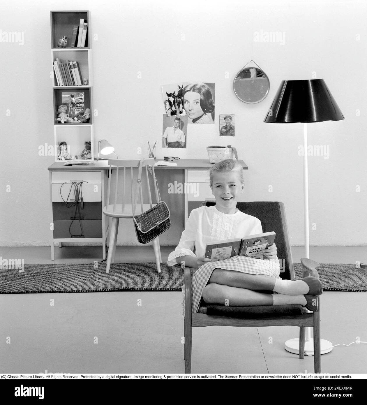 In the 1960s. A teenage girl in her typical 1960s room, a desk and her ...