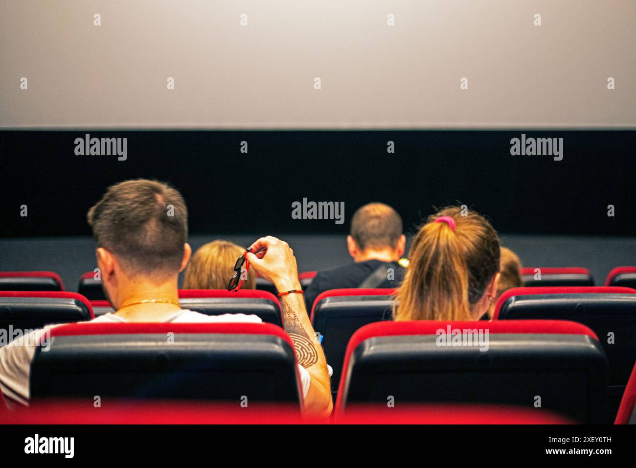 moviegoers before the premiere of the film. family day off Stock Photo ...