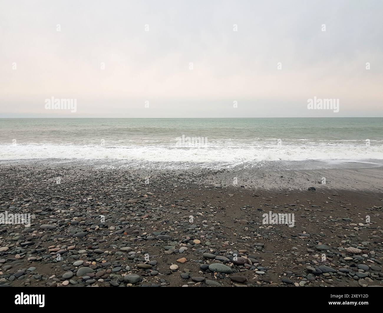 Gray nature background. Empty beach and sea Stock Photo - Alamy