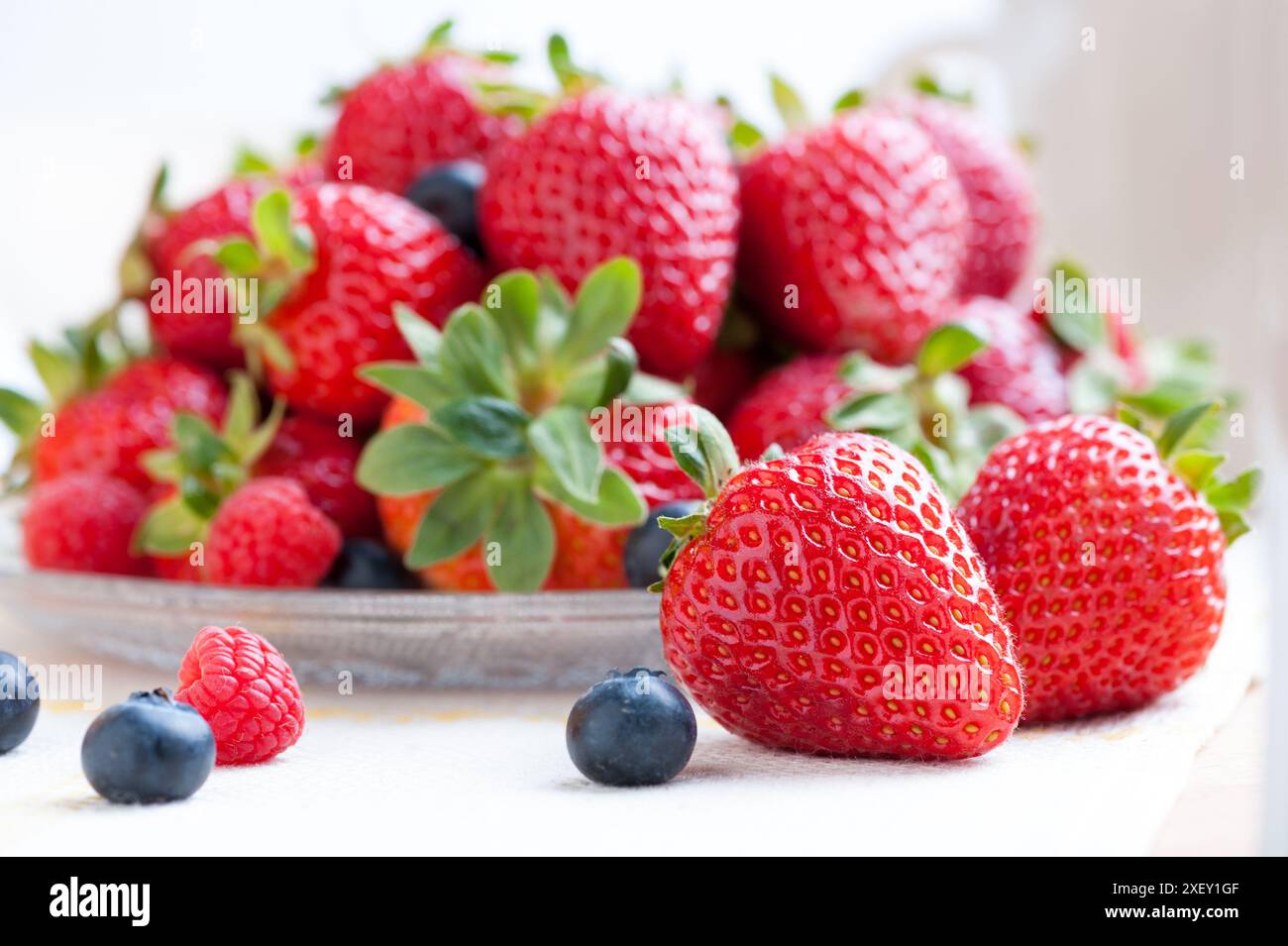 still life of strawberries and raspberries accompanied by berries Stock ...