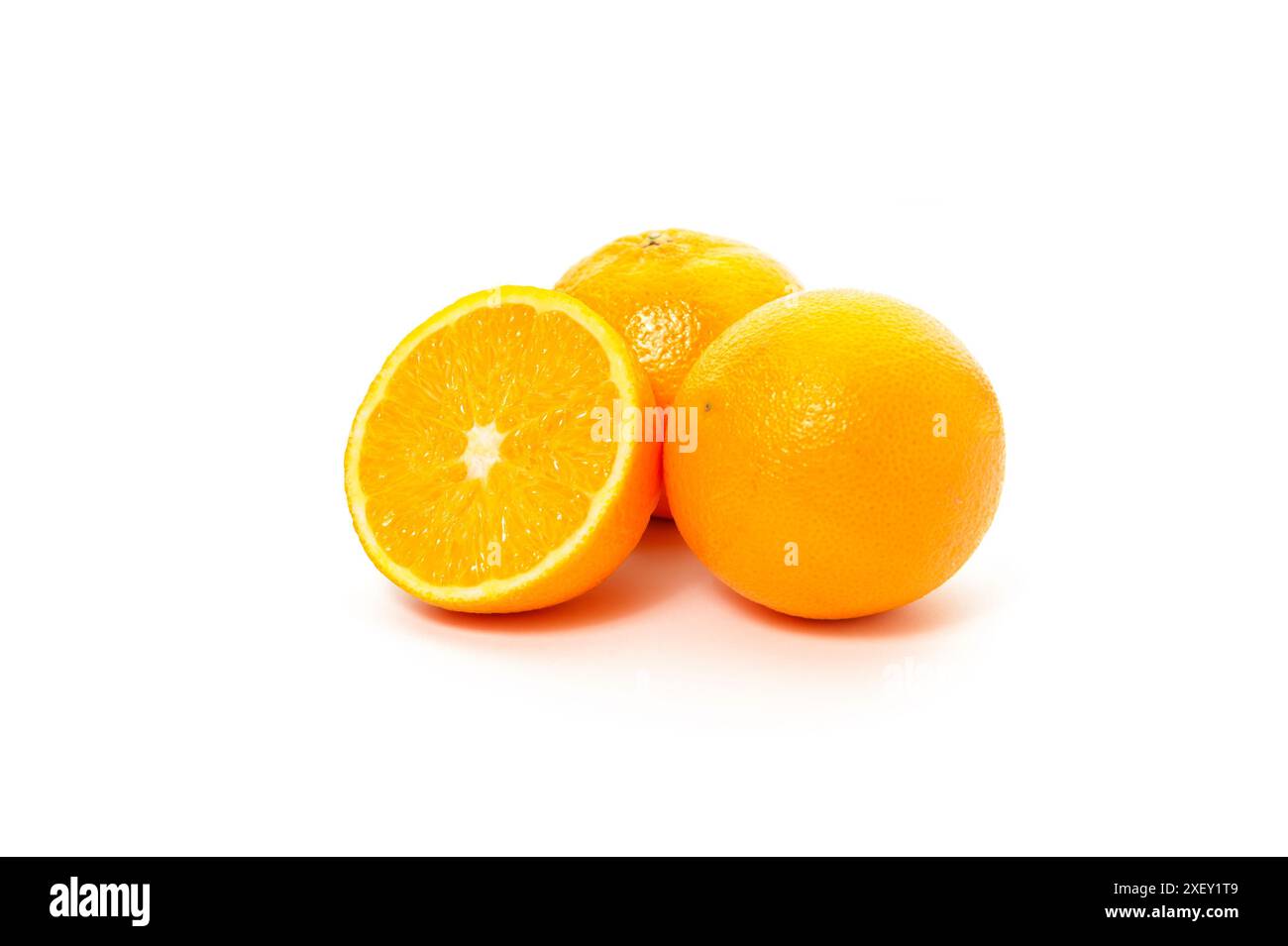 orange cut into sections isolated on white background Stock Photo - Alamy