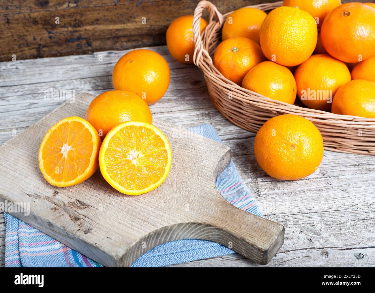 still life of oranges on wicker and wood background Stock Photo - Alamy