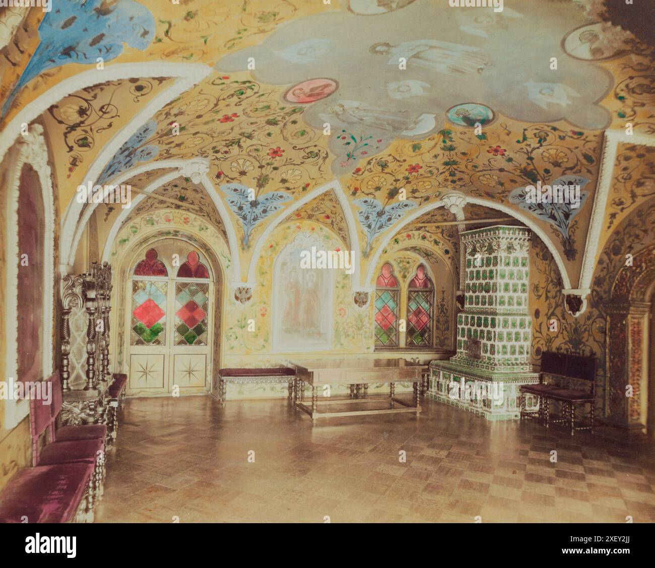 Vintage photo of interior with decorated ceiling, icons and stove in ...