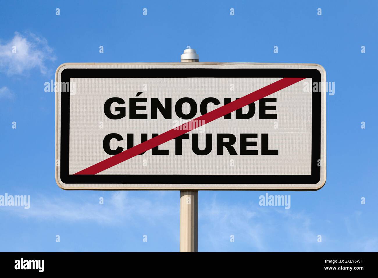 A French exit city sign against a blue sky with written in the middle ...