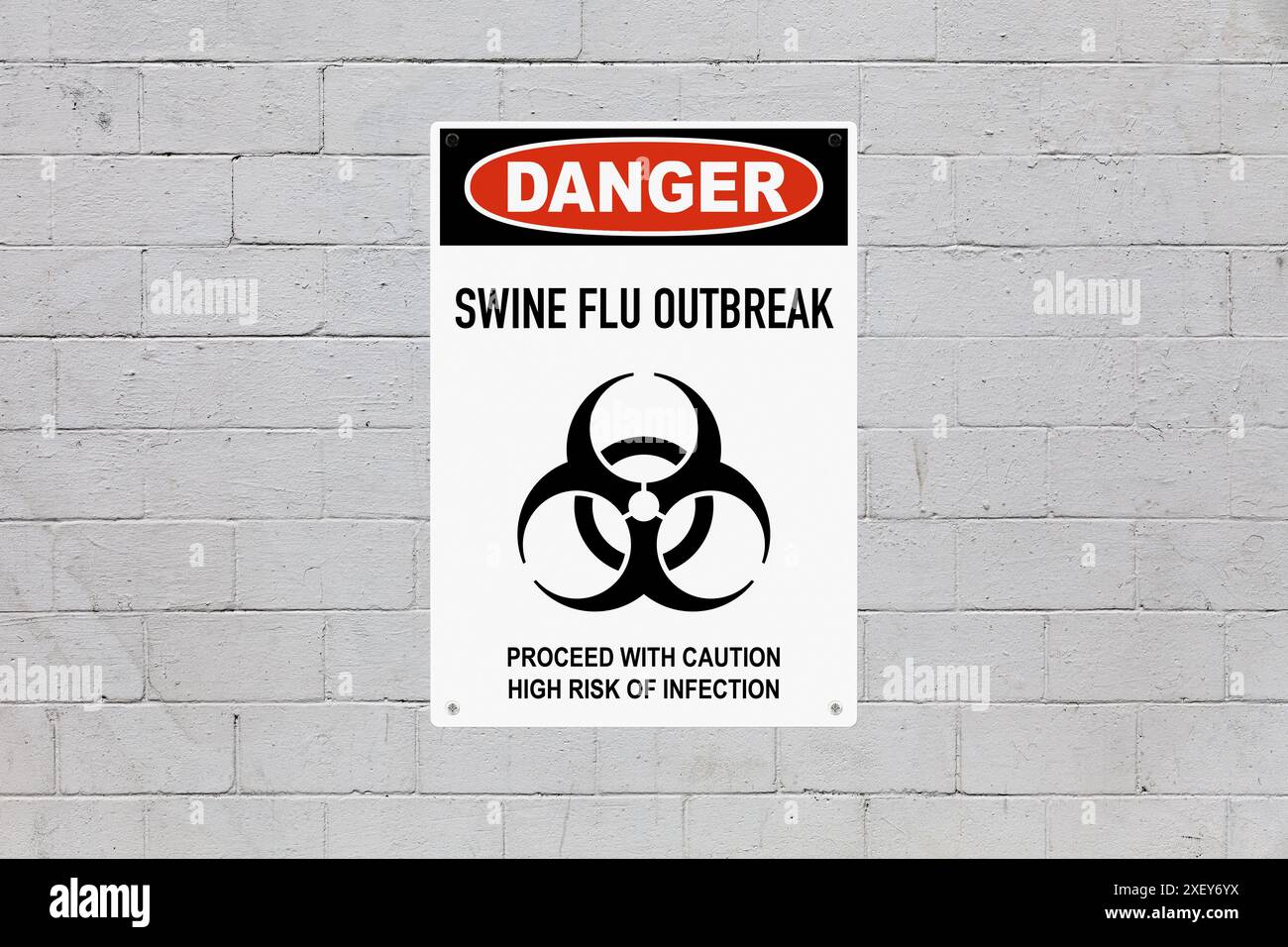 Warning sign screwed to a cinder block wall to warn about a health ...