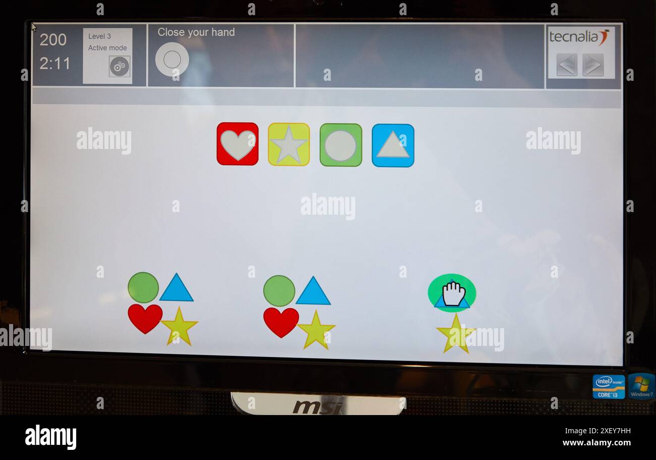 Patient with assistive robot for upper limb rehabilitation, The robot ...