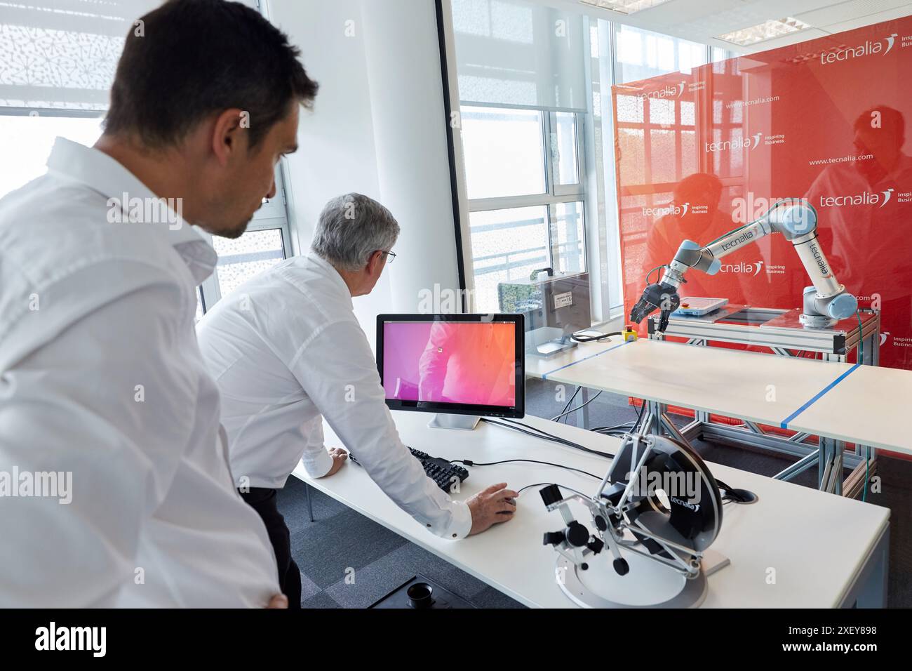 Robot composed of two pieces, a robotic arm, motorized by a clamp to ...