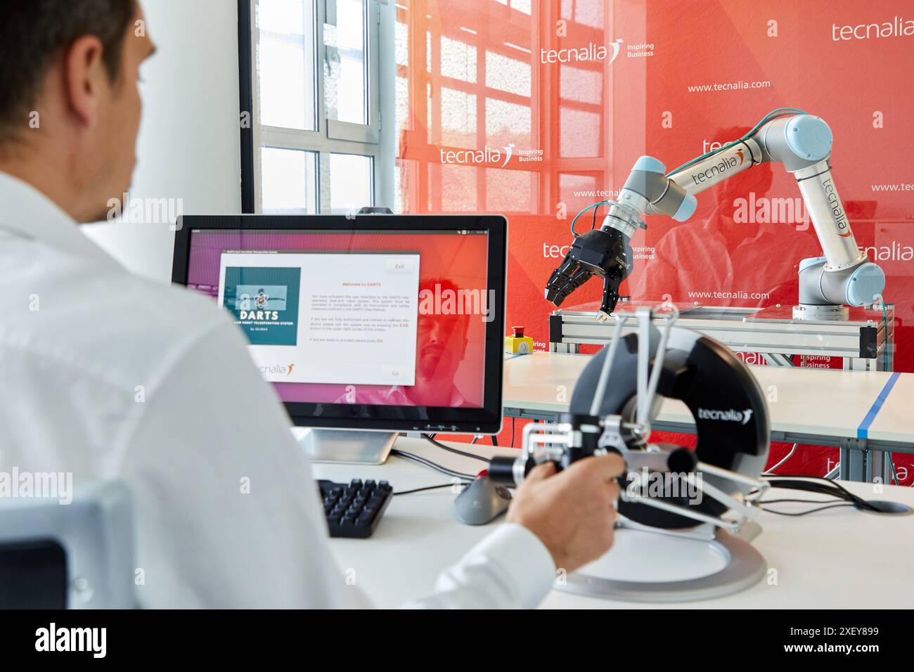 Robot composed of two pieces, a robotic arm, motorized by a clamp to ...