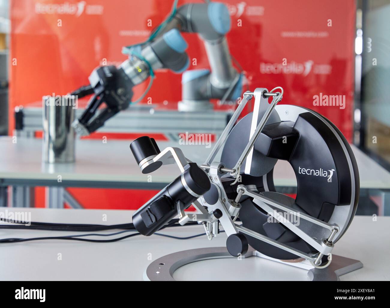 Robot composed of two pieces, a robotic arm, motorized by a clamp to ...