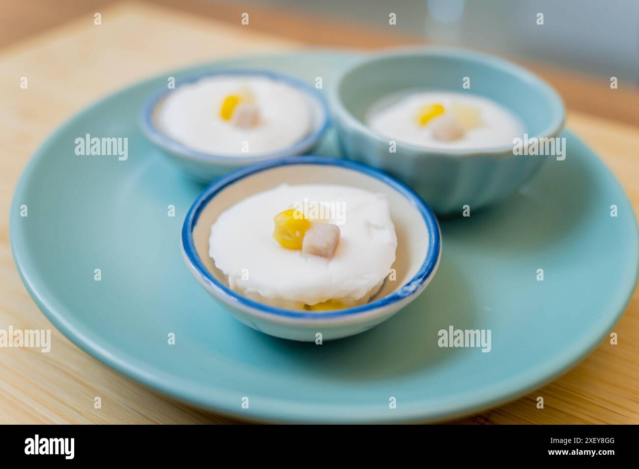 Different color delicious Japanese mochi on the blue plate Stock Photo ...