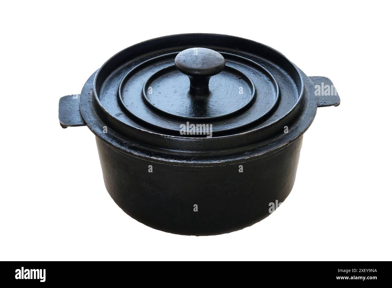 Cast iron used saucepan with closed lid isolated on white background ...