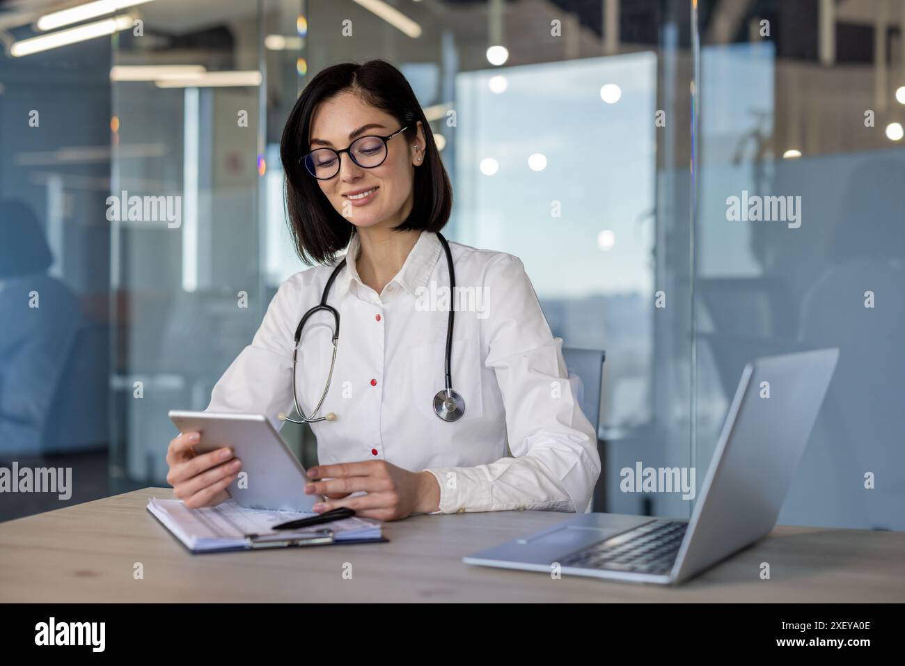 Female doctor stethoscope reviewing tablet hi-res stock photography and ...