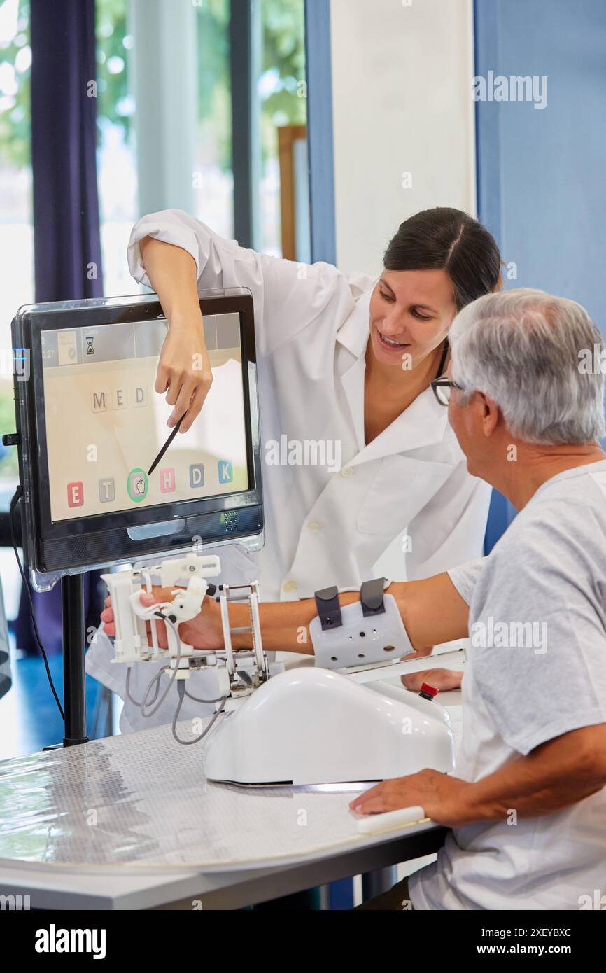 Therapist and patient with assistive robot for upper limb ...