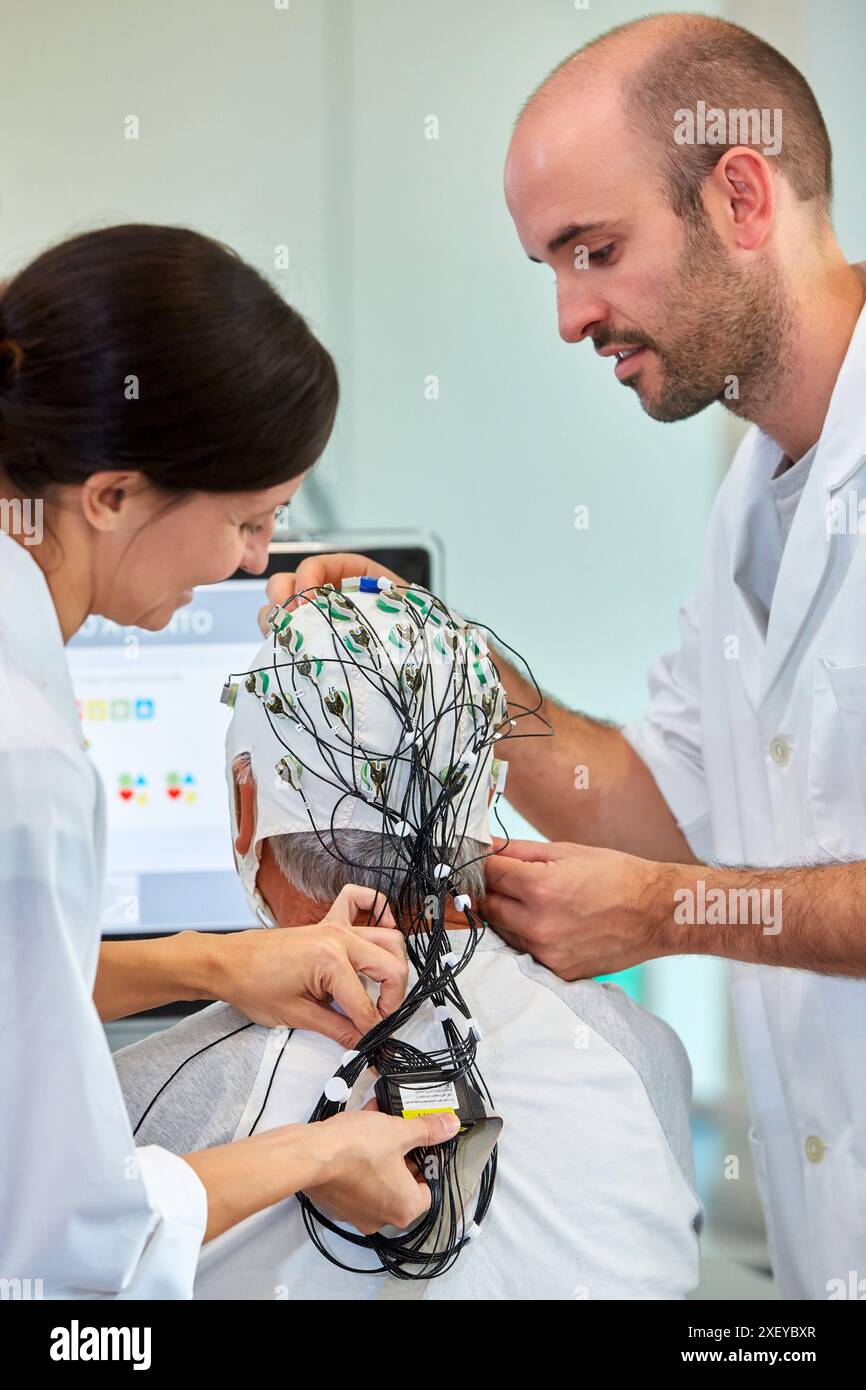 Investigator and patient with assistive robot for upper limb ...