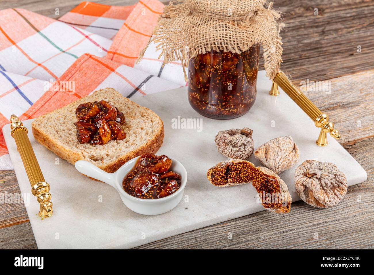 Flat composition with delicious fig jam on wooden table. Delicious fig ...