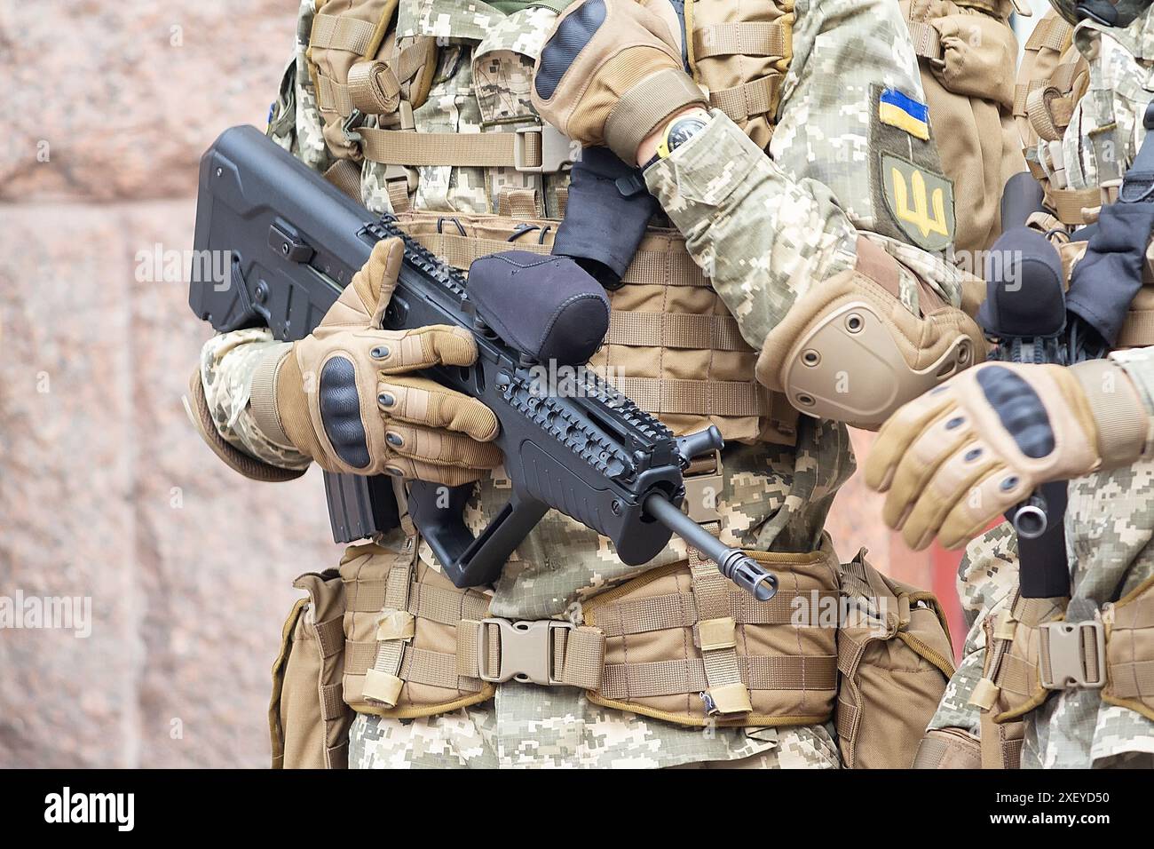 Modern assault rifles in the hands of Ukrainian army soldiers. Armed ...